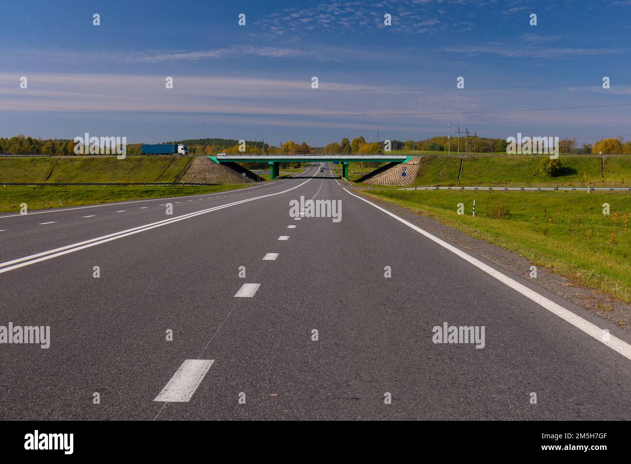 Bridge, roadside and asphalt, blue sky in the city streets in public ...