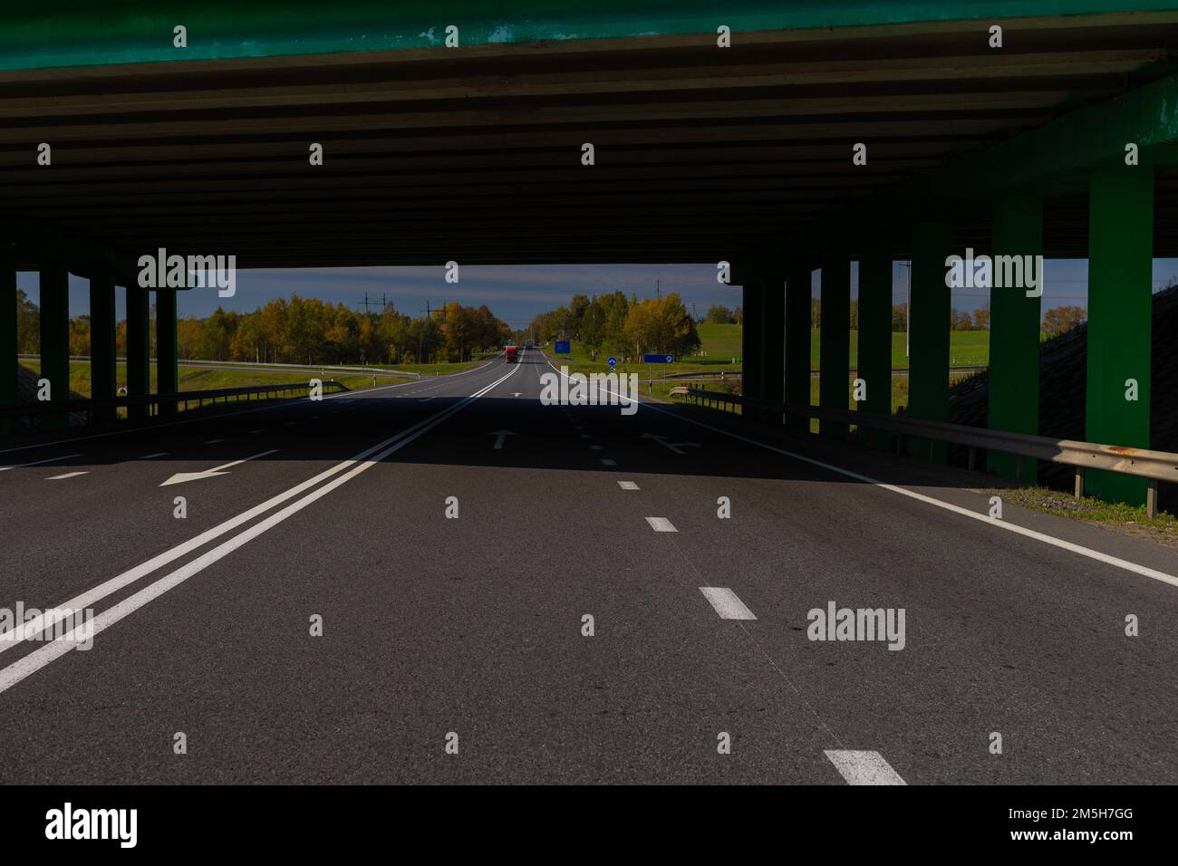 Bridge, roadside and asphalt, blue sky in the city streets in public ...