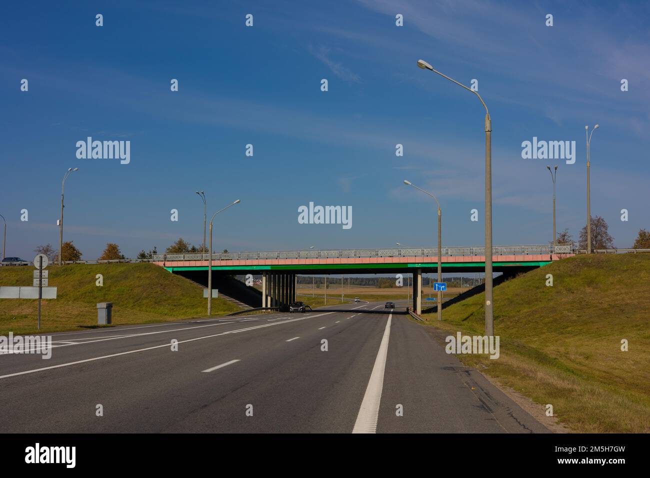 Bridge, roadside and asphalt, blue sky in the city streets in public ...