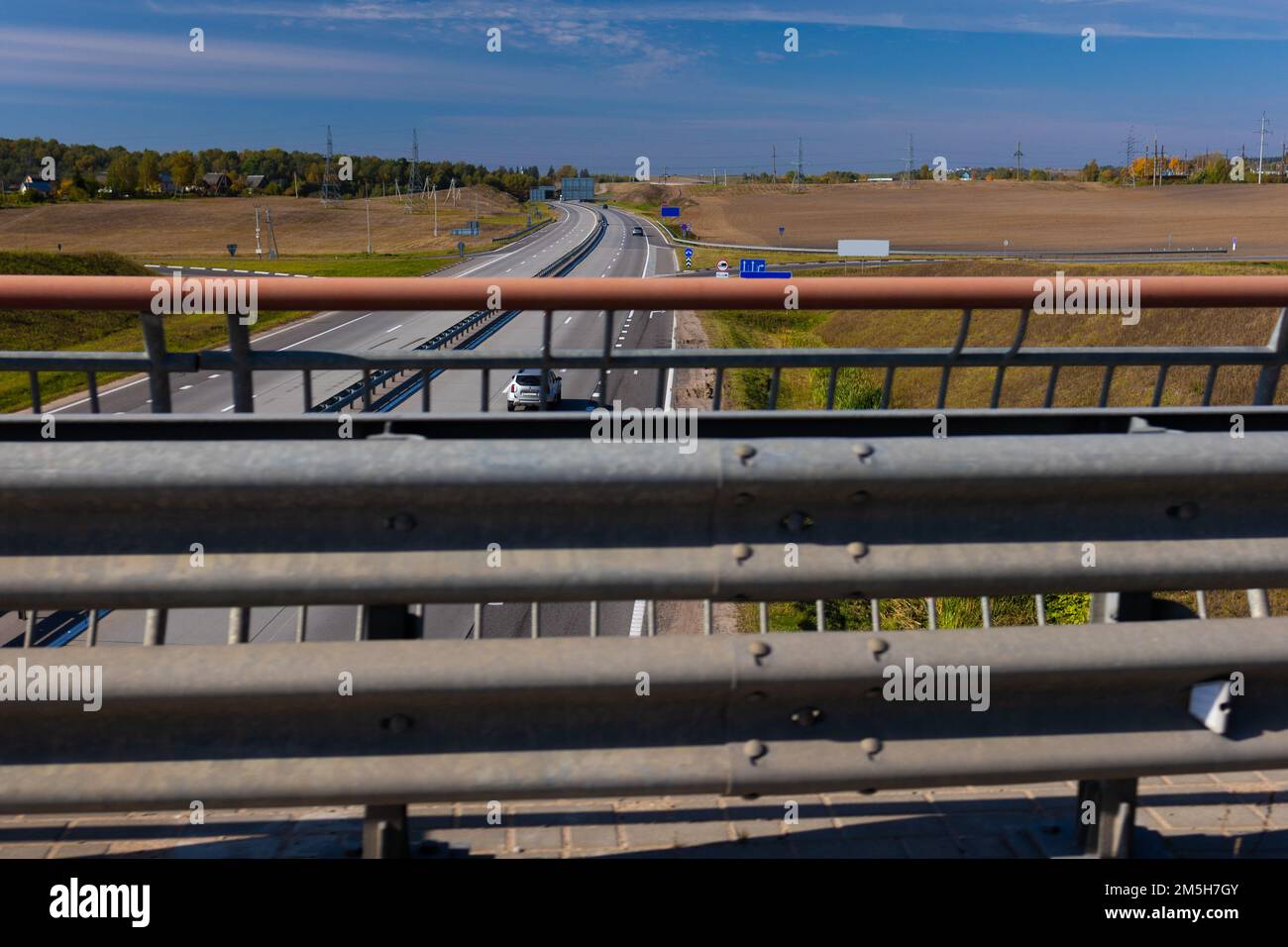 Bridge, roadside and asphalt, blue sky in the city streets in public ...