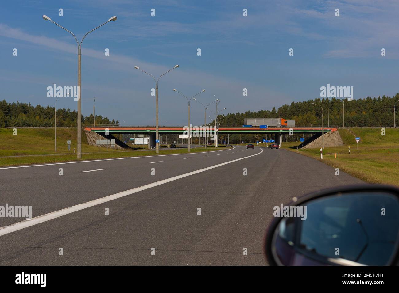Bridge, roadside and asphalt, blue sky in the city streets in public ...
