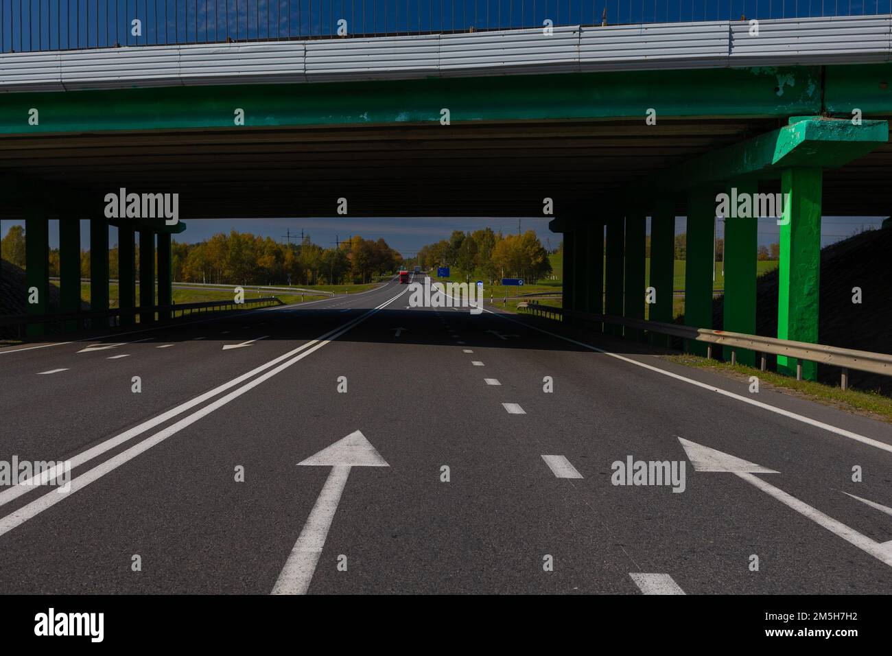 Bridge, roadside and asphalt, blue sky in the city streets in public ...