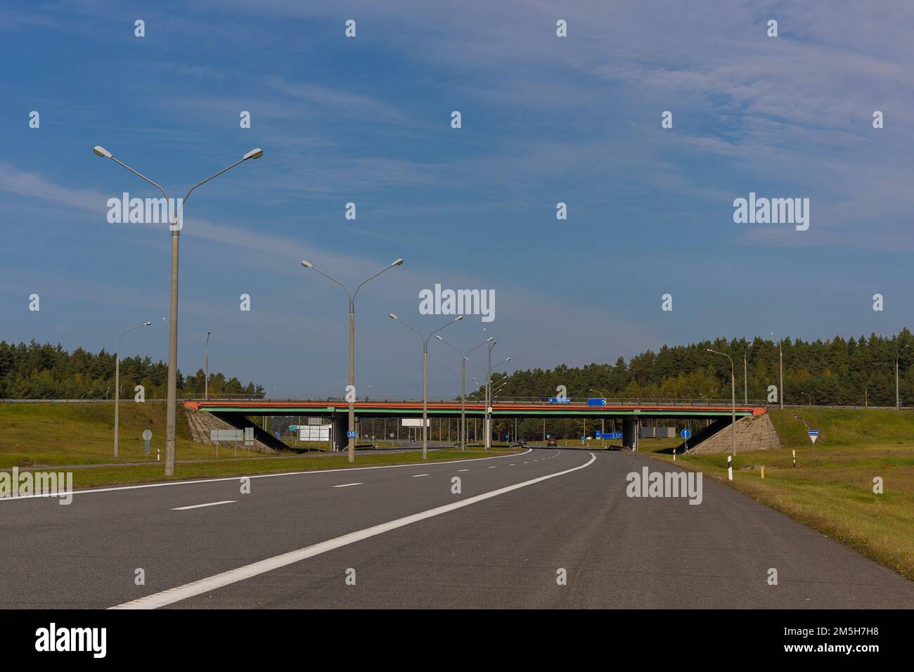 Bridge, roadside and asphalt, blue sky in the city streets in public ...