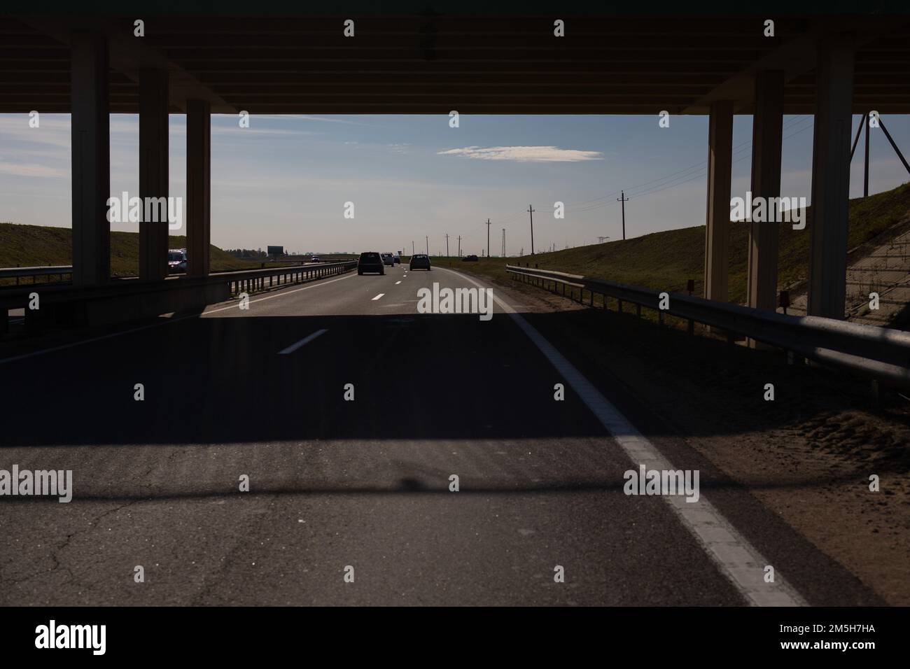 Bridge, roadside and asphalt, blue sky in the city streets in public ...