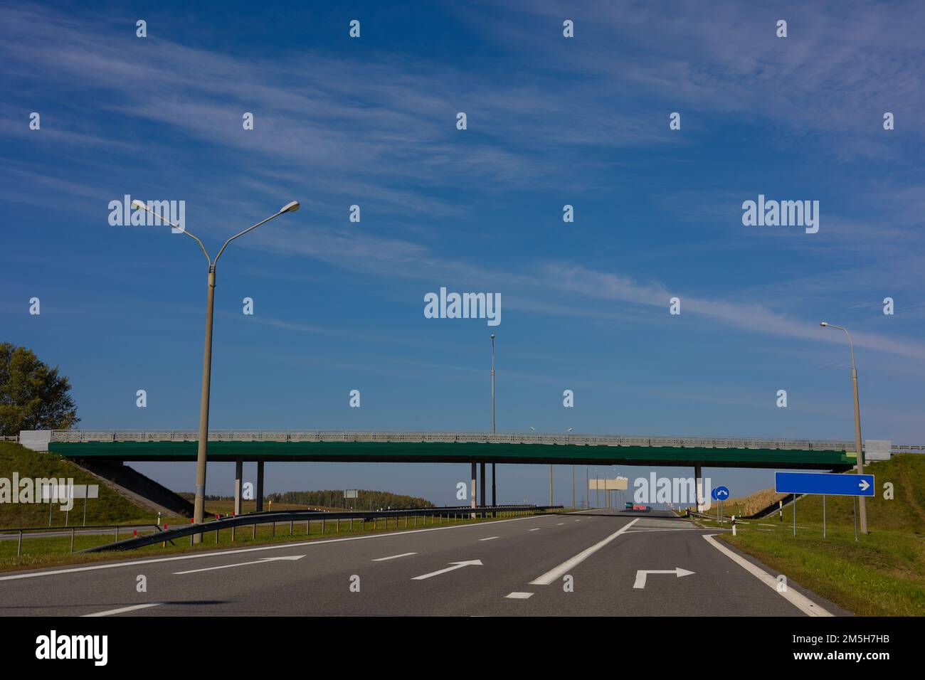 Bridge, roadside and asphalt, blue sky in the city streets in public ...