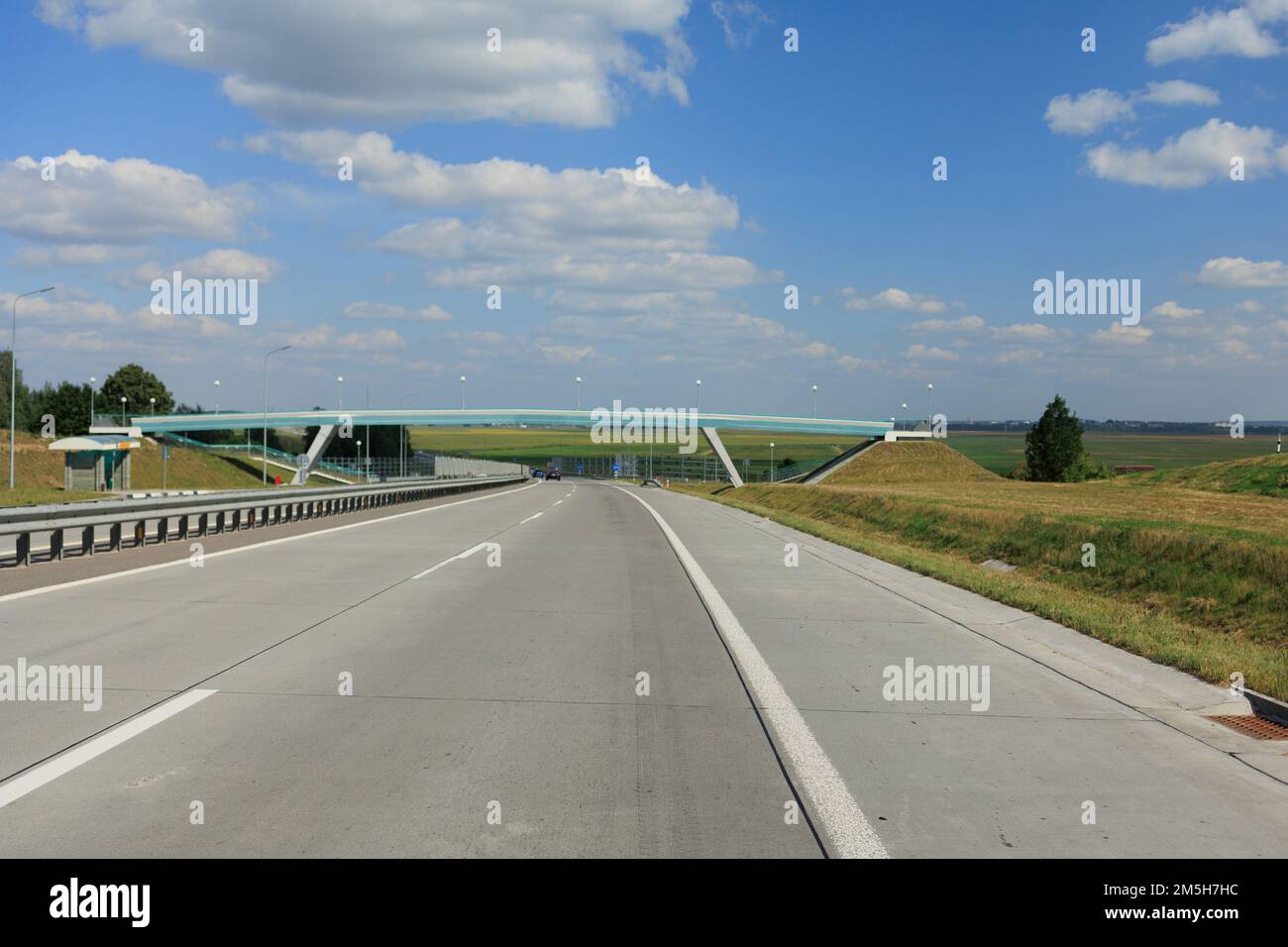 Bridge, roadside and asphalt, blue sky in the city streets in public ...