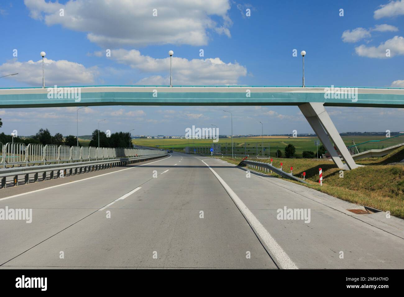 Bridge, roadside and asphalt, blue sky in the city streets in public ...