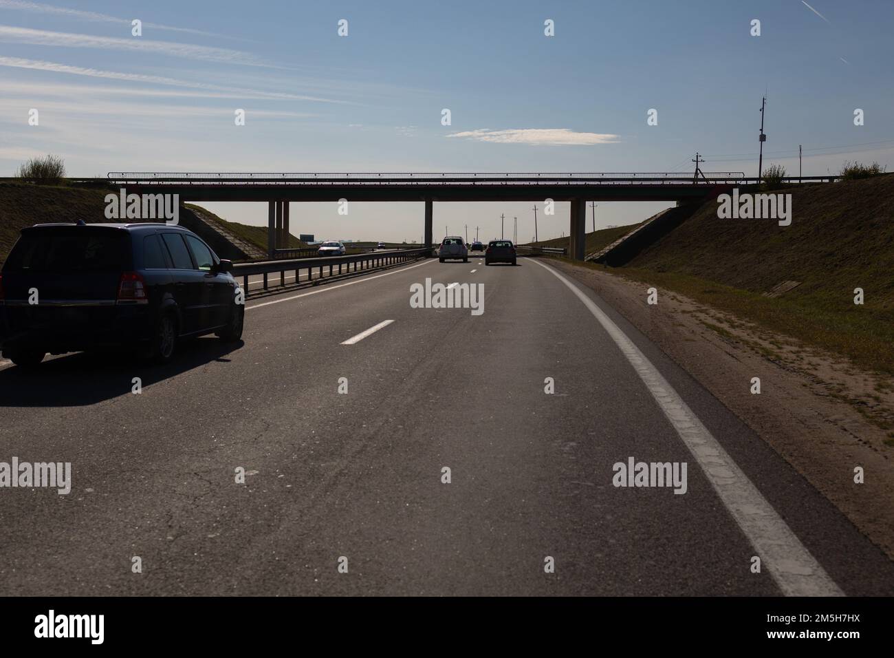Bridge, roadside and asphalt, blue sky in the city streets in public ...