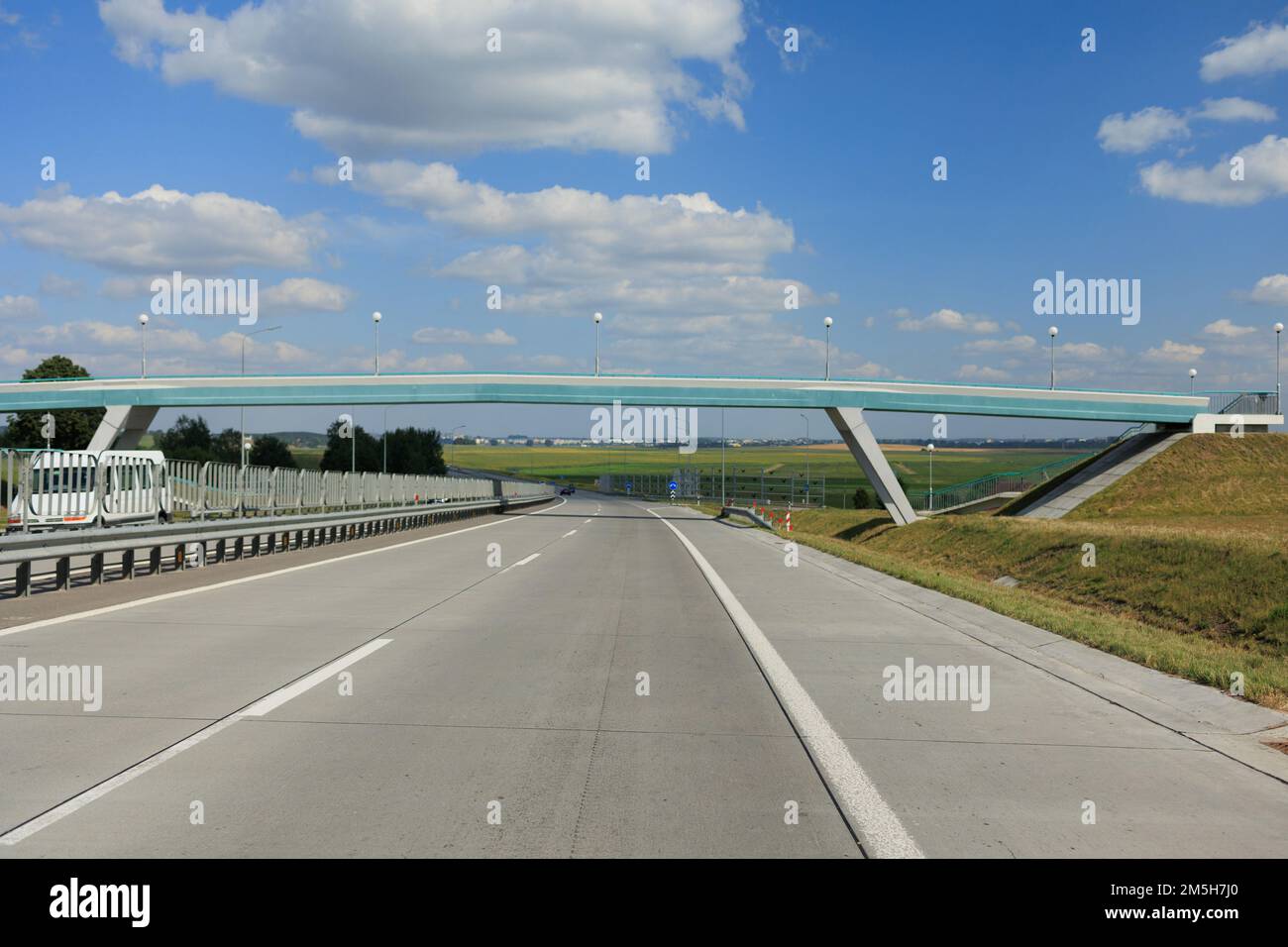 Bridge, roadside and asphalt, blue sky in the city streets in public ...