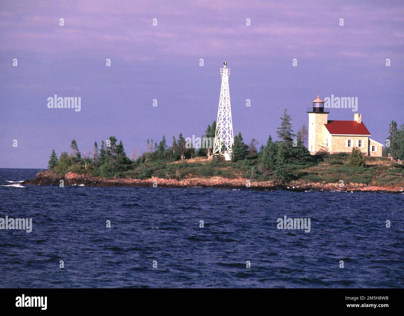 Copper Country Trail - Copper Harbor Lighthouse. Waves crash against ...