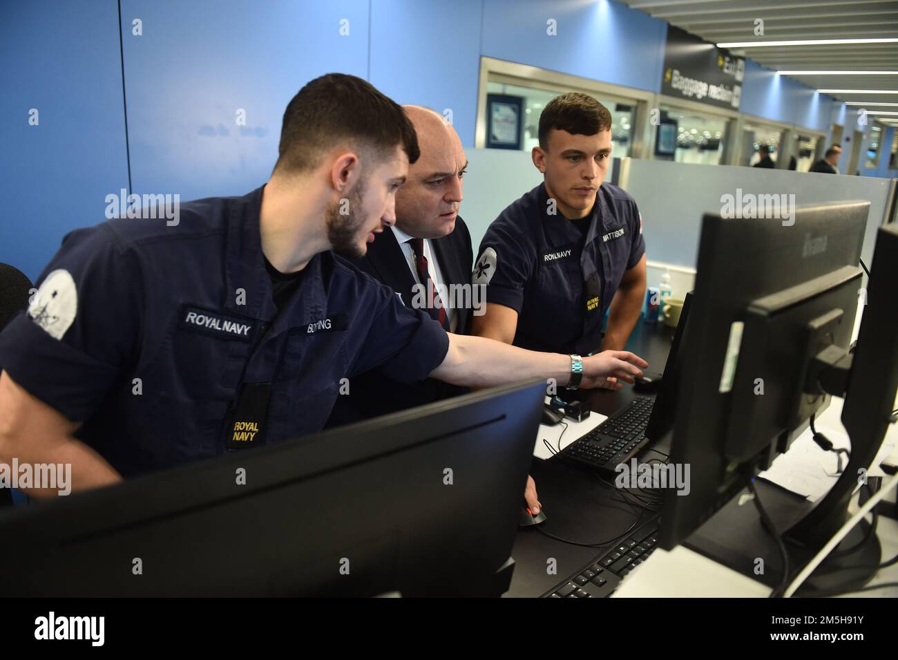 Defence Secretary Ben Wallace (centre) at passport control at ...