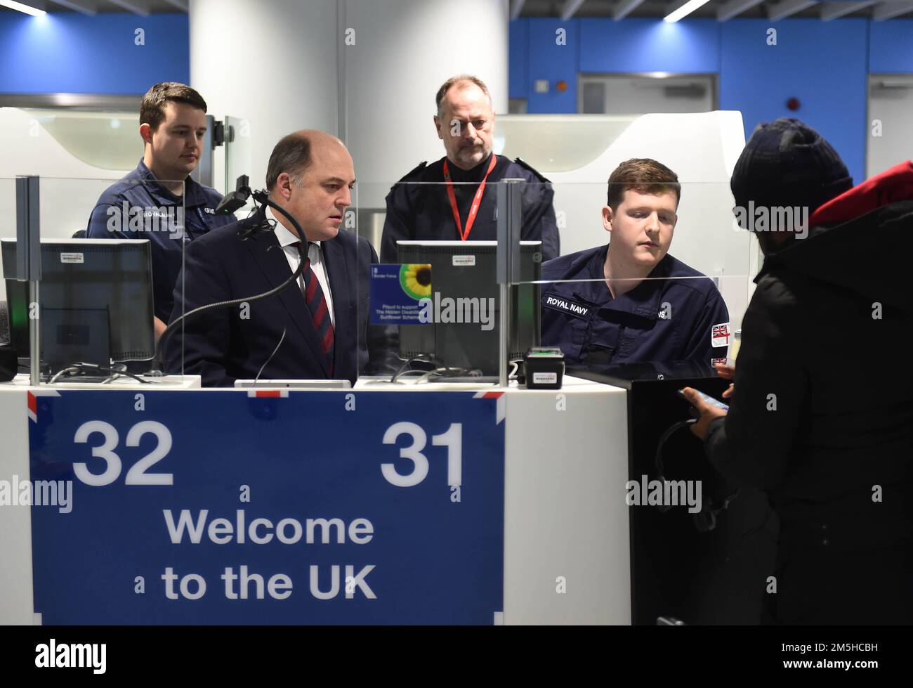Defence Secretary Ben Wallace (2nd left) at passport control at ...