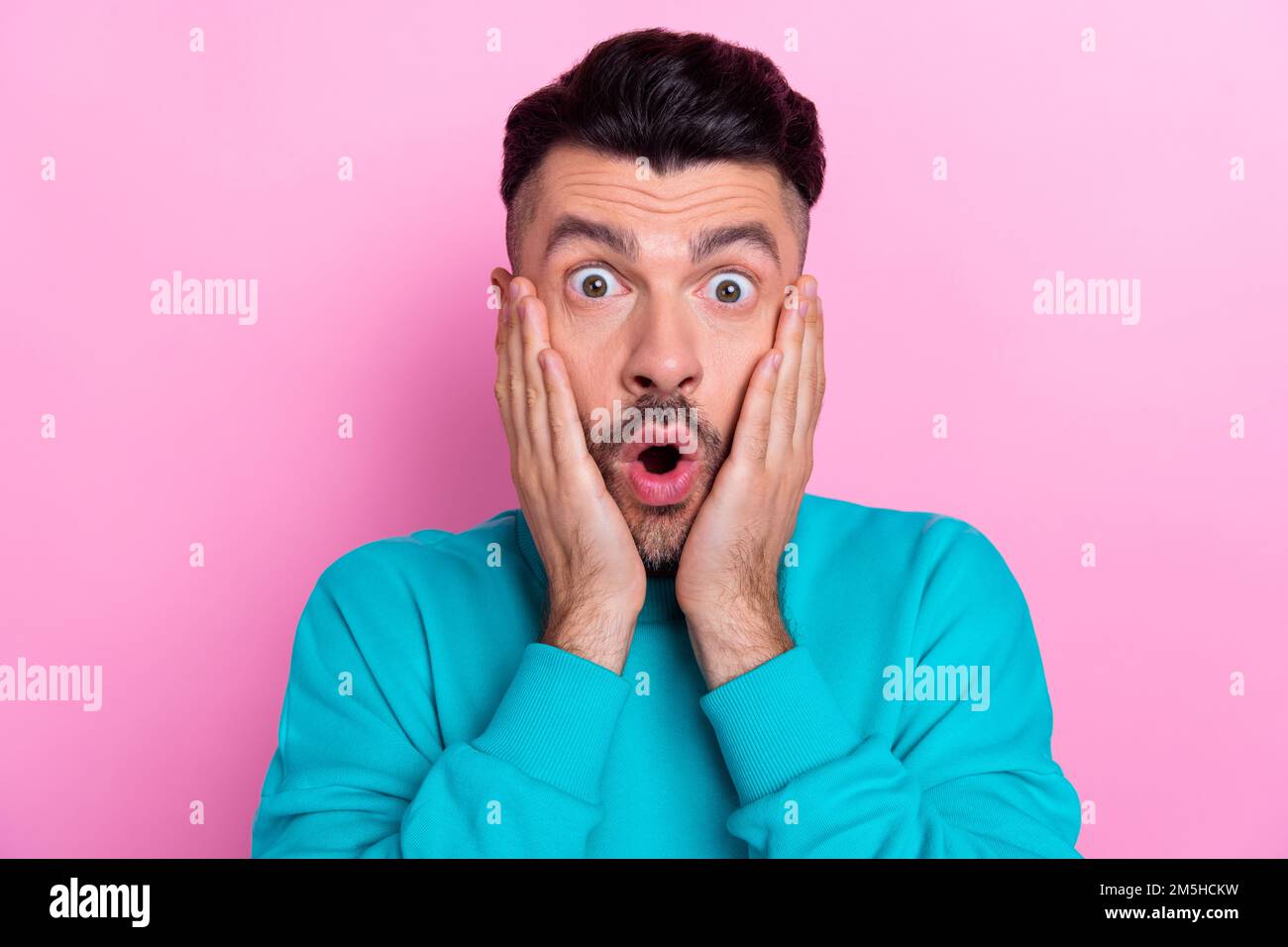 Closeup portrait of funny face man pouted lips open mouth touch cheeks ...