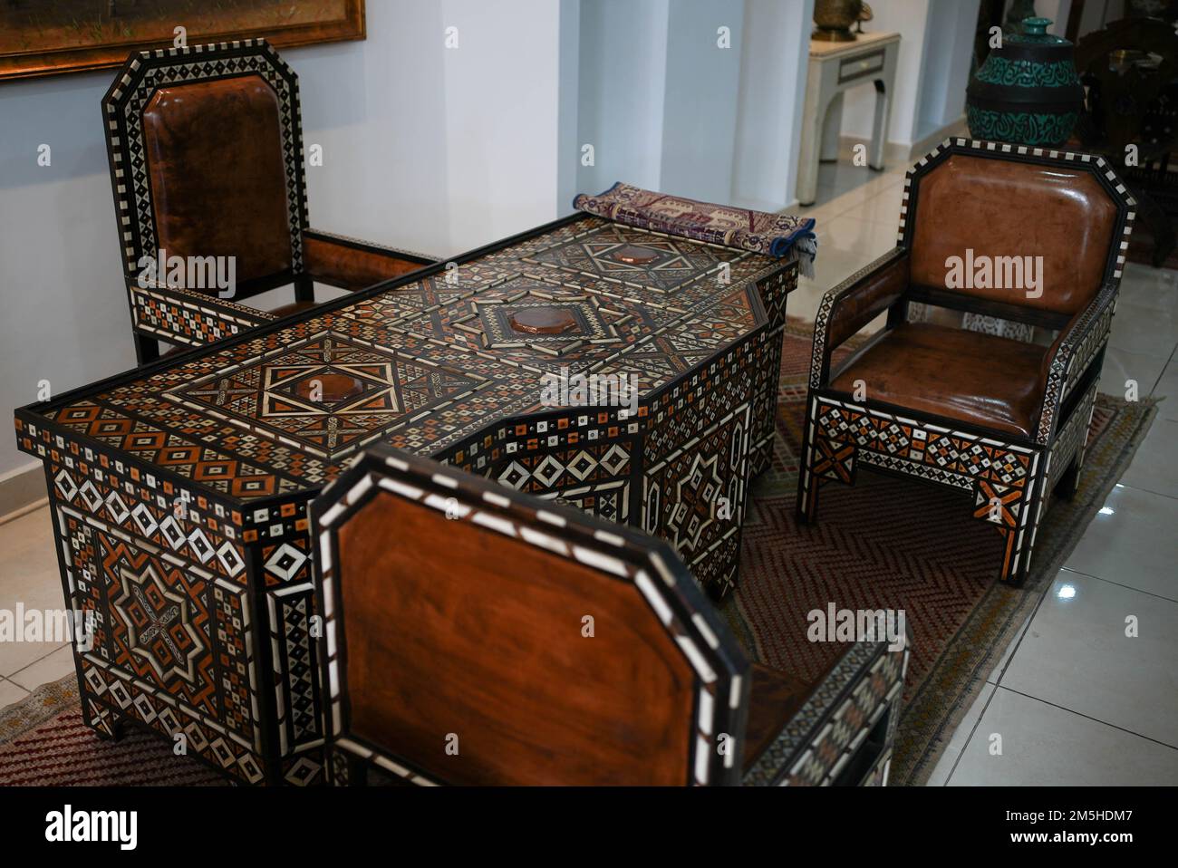 Hand crafted arabic style wooden table and chairs Stock Photo - Alamy