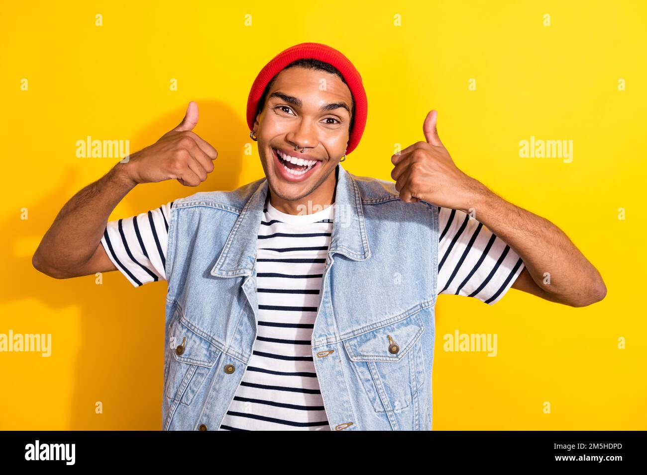 Portrait of crazy positive handsome man toothy smile show thumb up rate ...