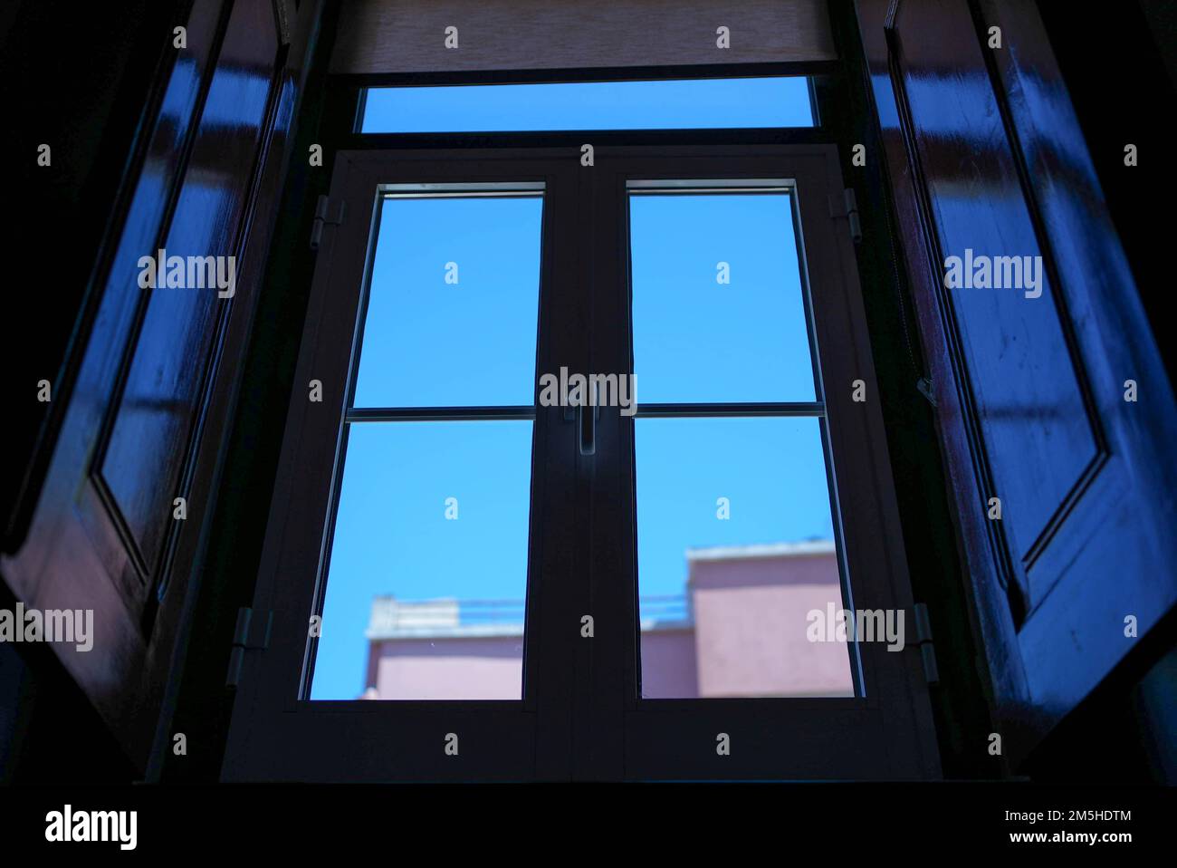 Window looking out towards the clear perfect blue sky Stock Photo - Alamy