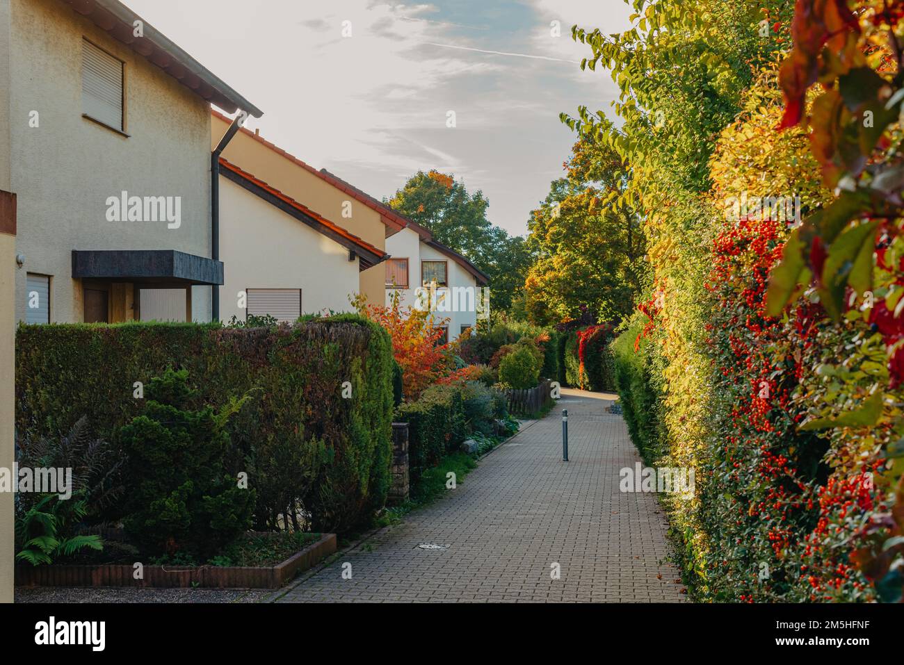 Old white cottage in cozy town. Street view landscape old city, little ...