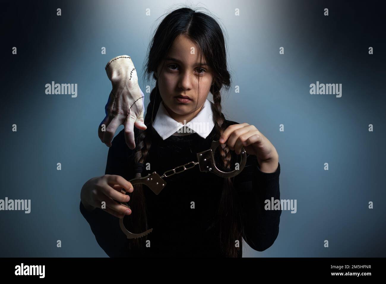 Wednesday Addams. Angry girl student Stock Photo - Alamy