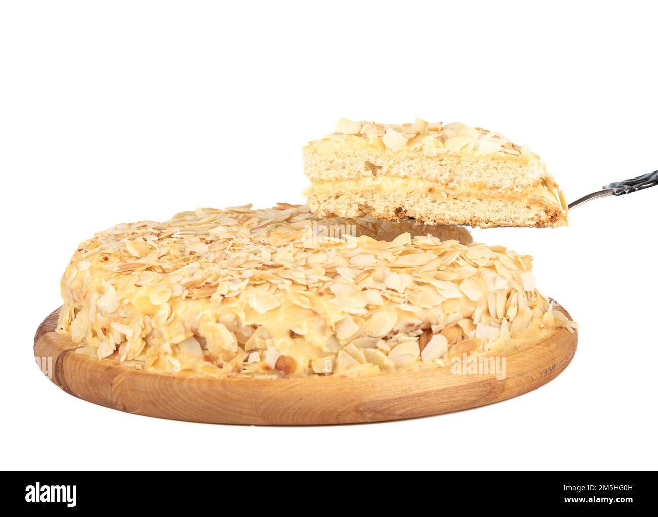 Piece of Swedish cream cake on a kitchen spatula. Sliced delicious ...