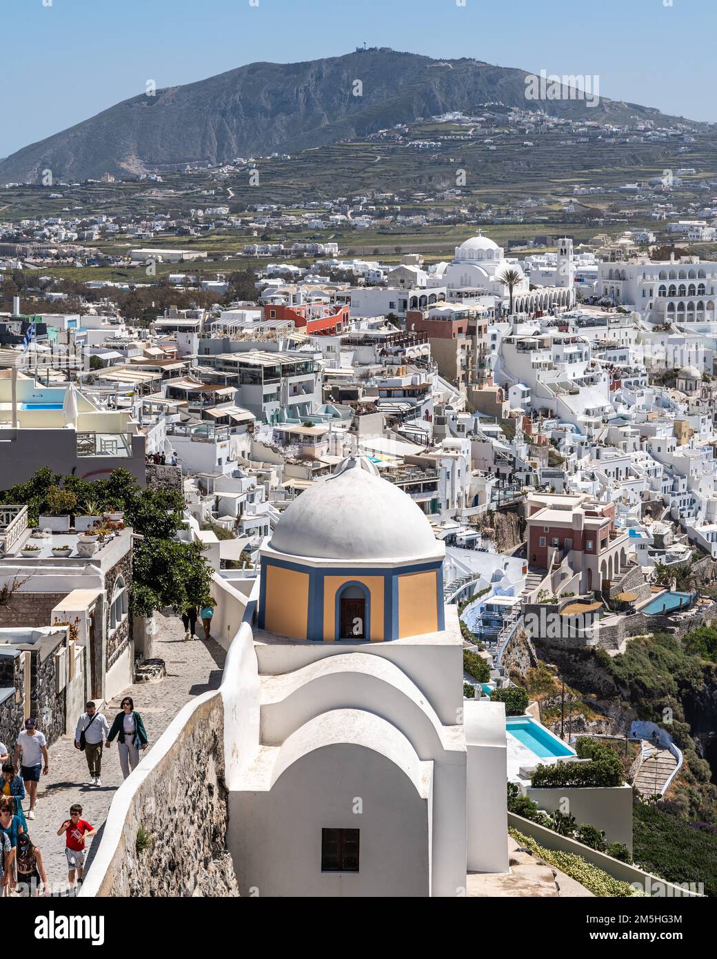 A vertical of a beautiful church against the densely populated ...