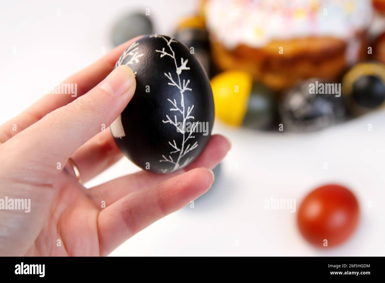 Defocus Easter black egg with tree ornament. Easter cake craffin. Close ...