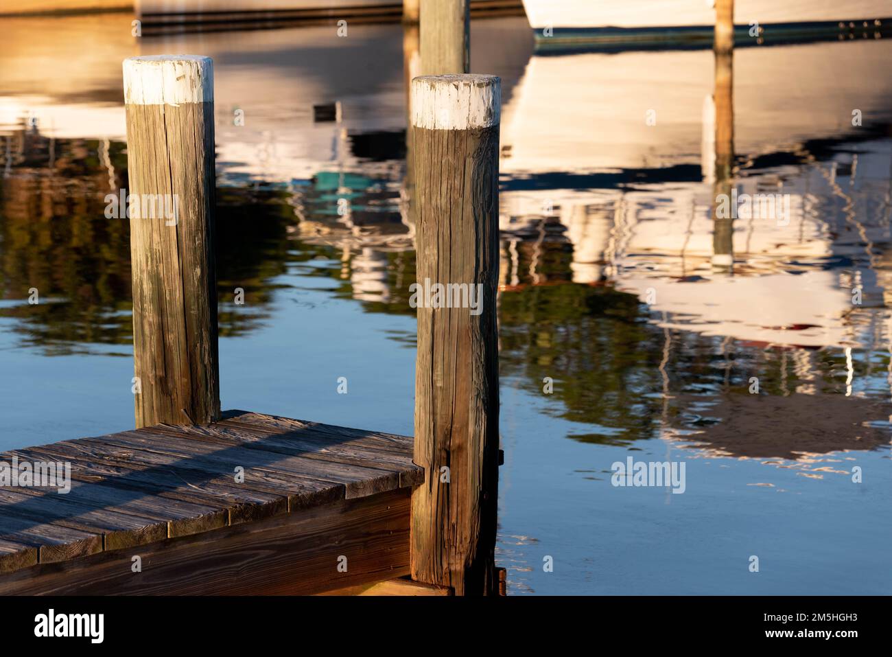 Reflections of water from a dock slip Stock Photo - Alamy