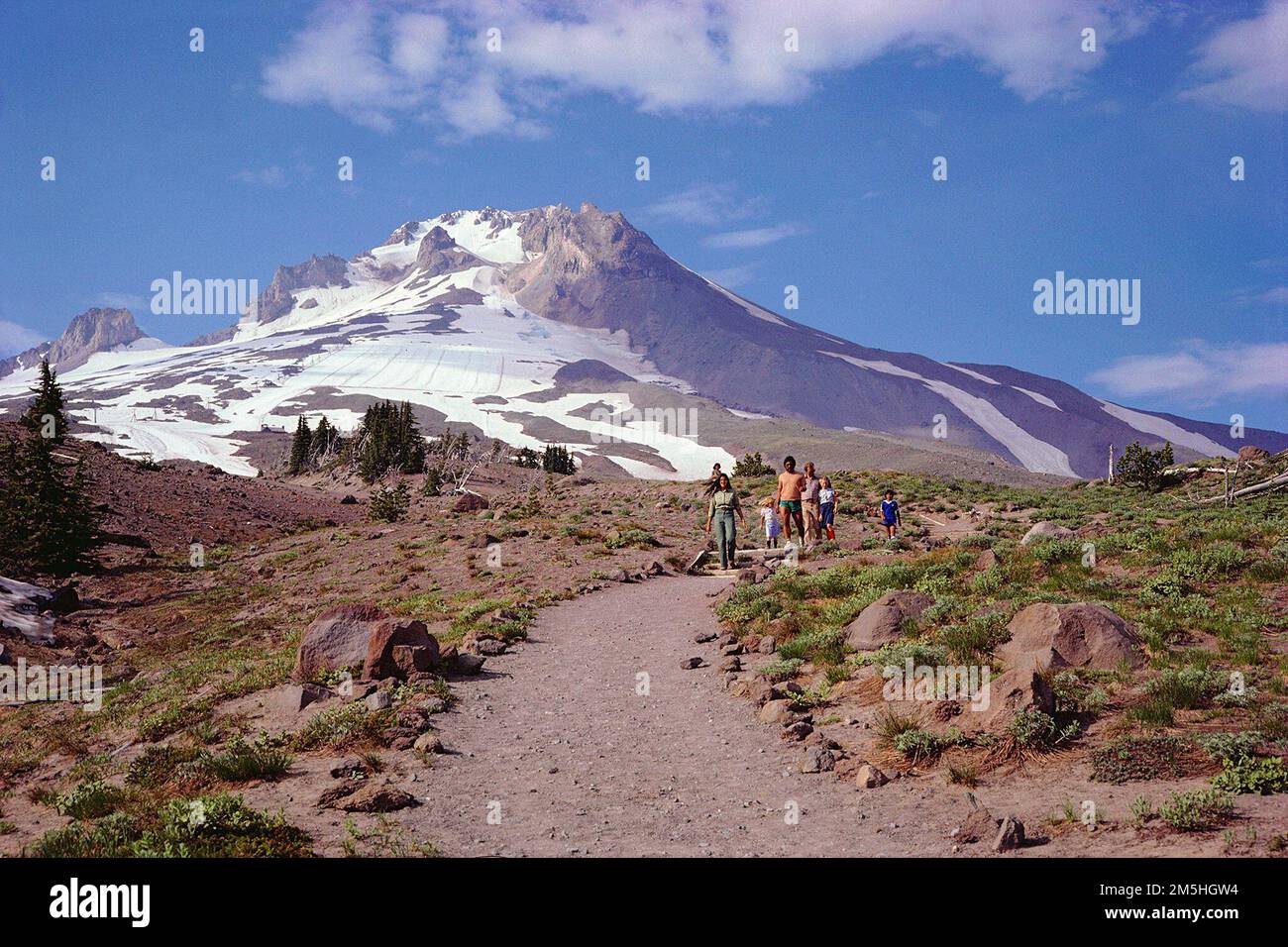 Mt. Hood Scenic Byway - Hiking Along Mt. Hood. A group of visitors hike ...