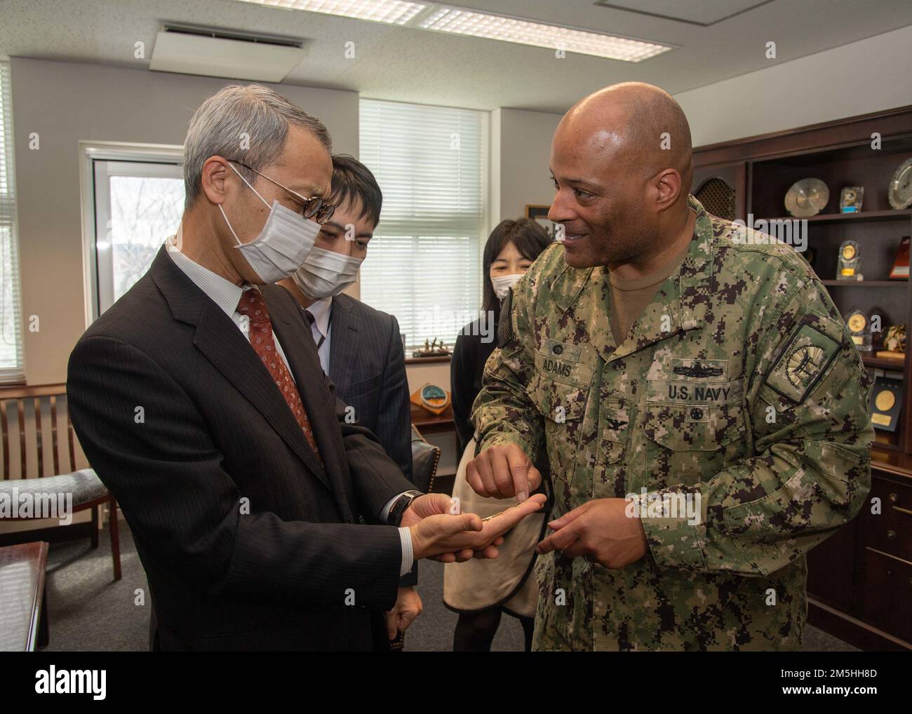 Capt. David Adams, Commander, Fleet Activities Sasebo (CFAS) gives a ...