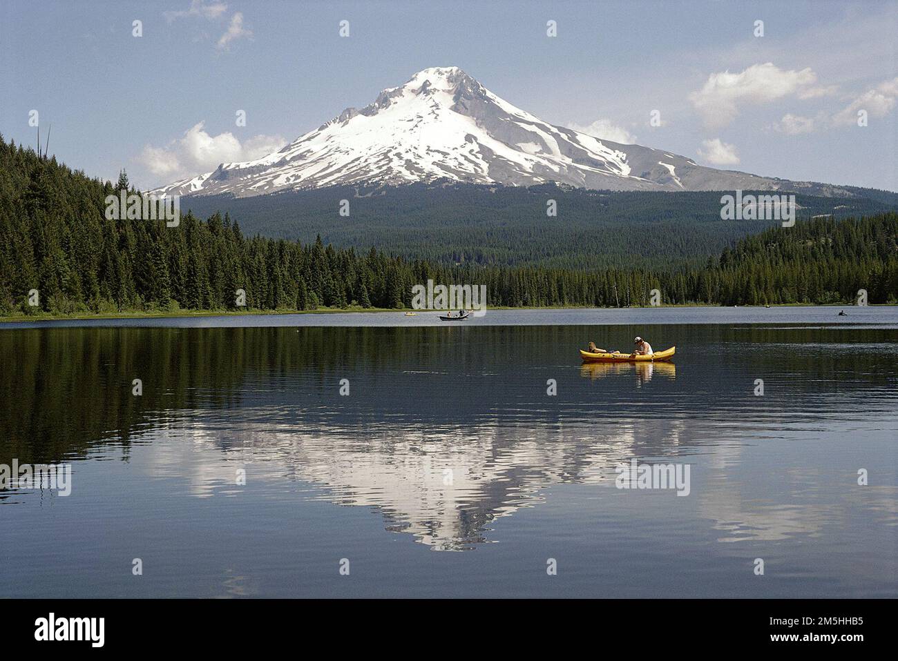 Mt. Hood Scenic Byway - Trillium Lake in the Summer. A canoer glides ...