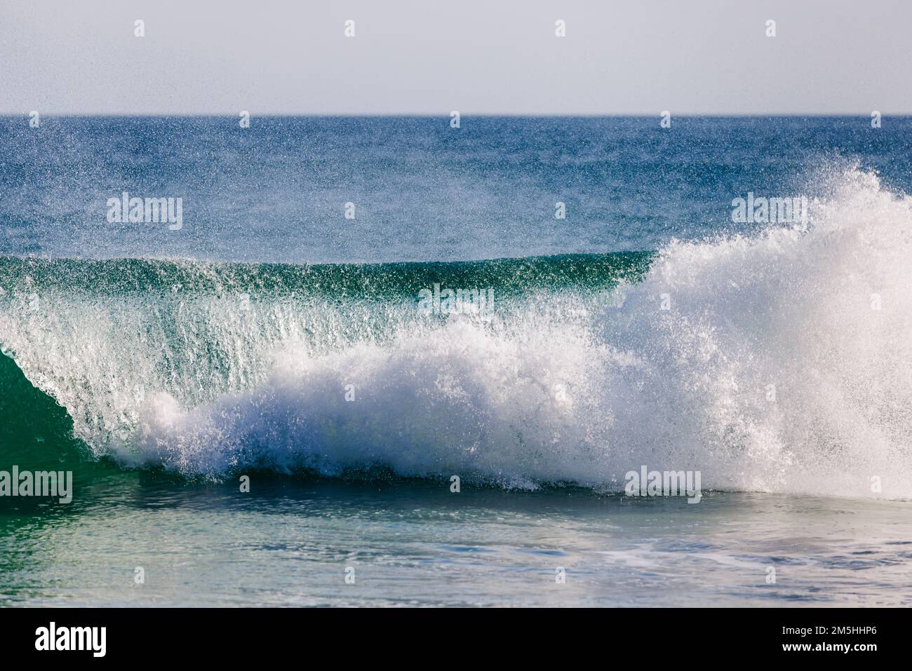 Breaking waves and surf seen from the beach at Kynance Cove on the ...
