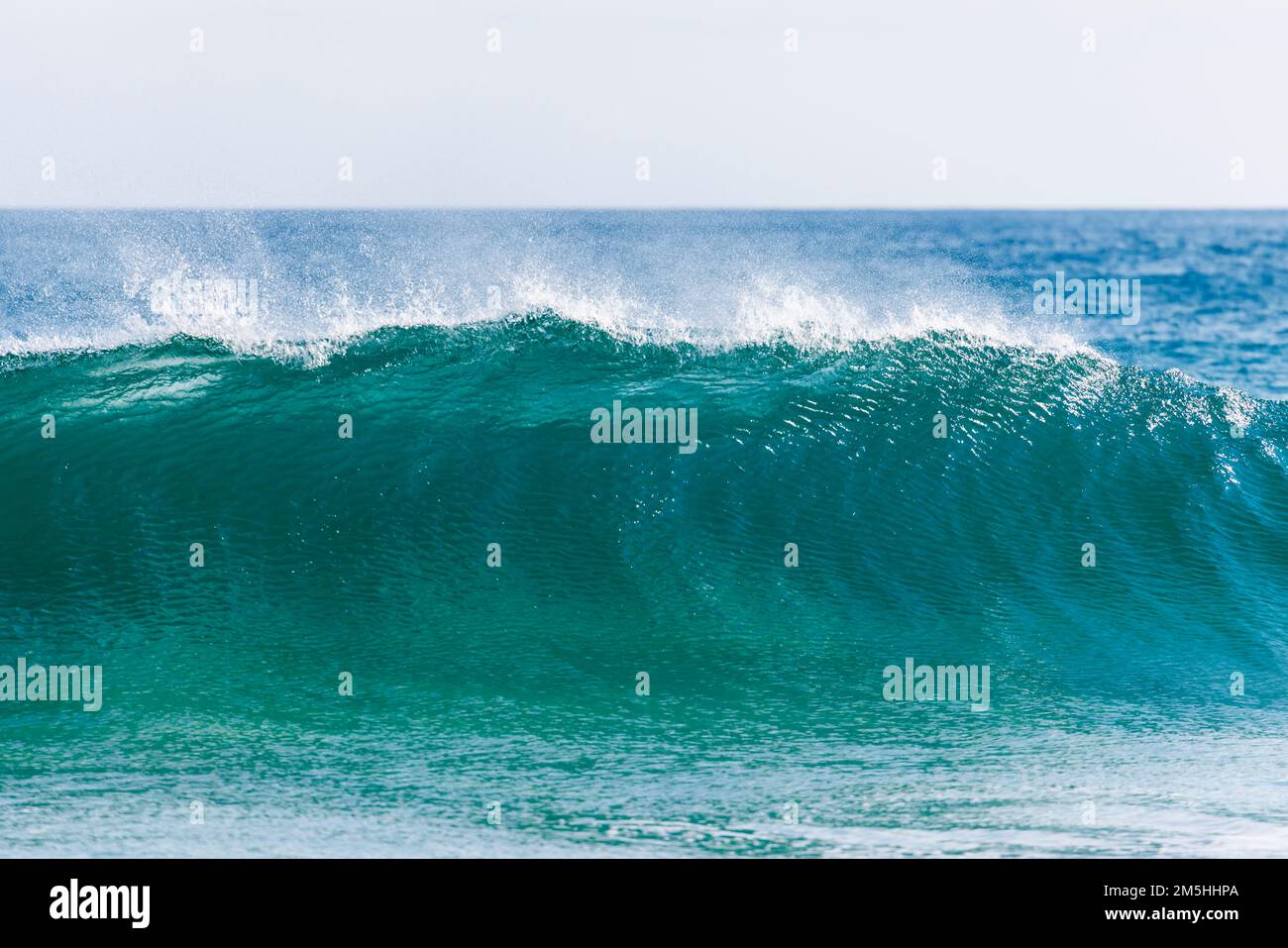 Breaking waves and surf seen from the beach at Kynance Cove on the ...