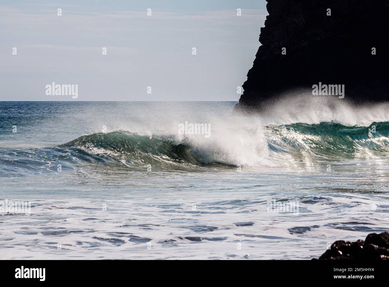 Breaking waves and surf seen from the beach at Kynance Cove on the ...