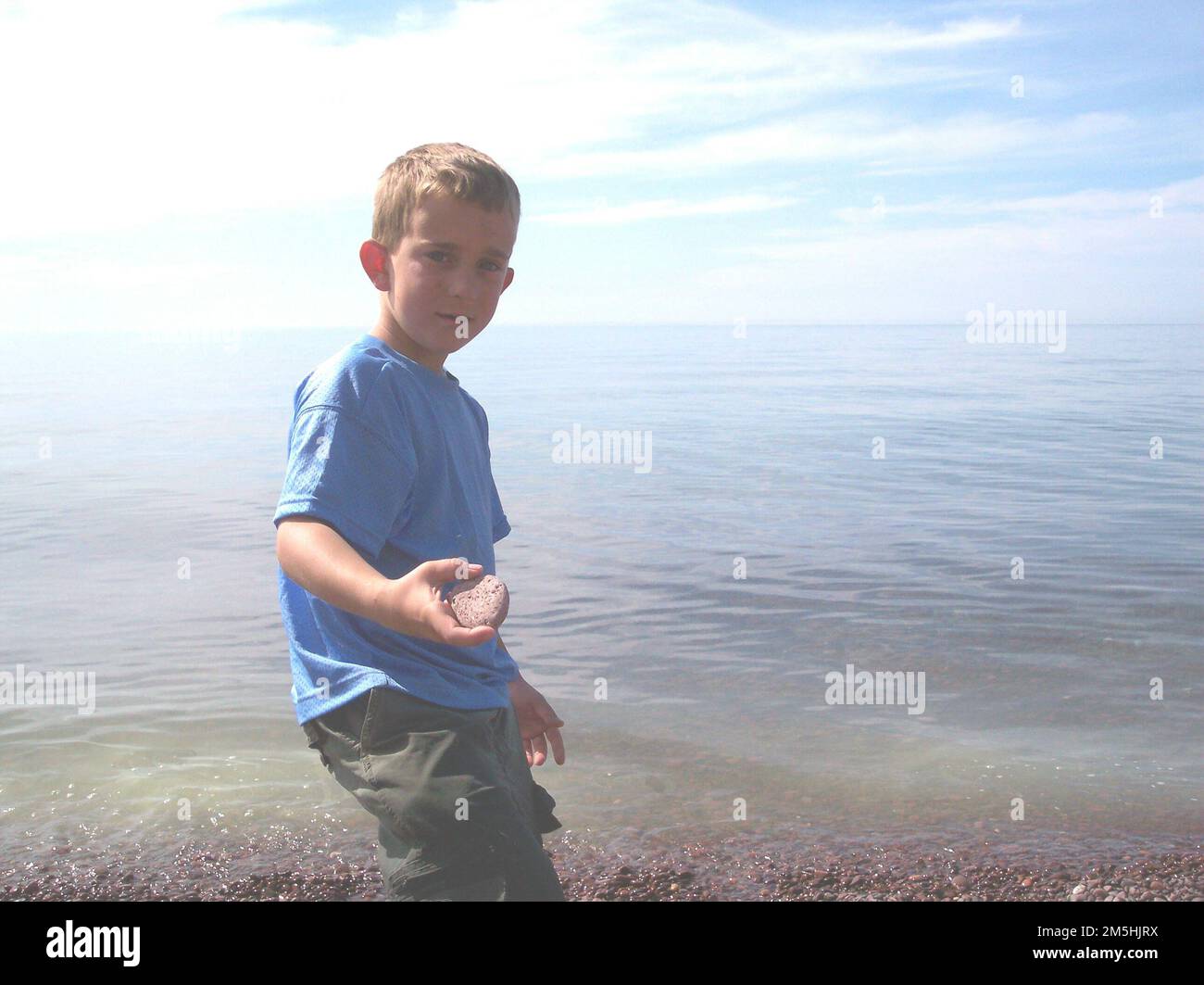 Copper Country Trail - Skippin' Rocks on Lake Superior. A young boy ...