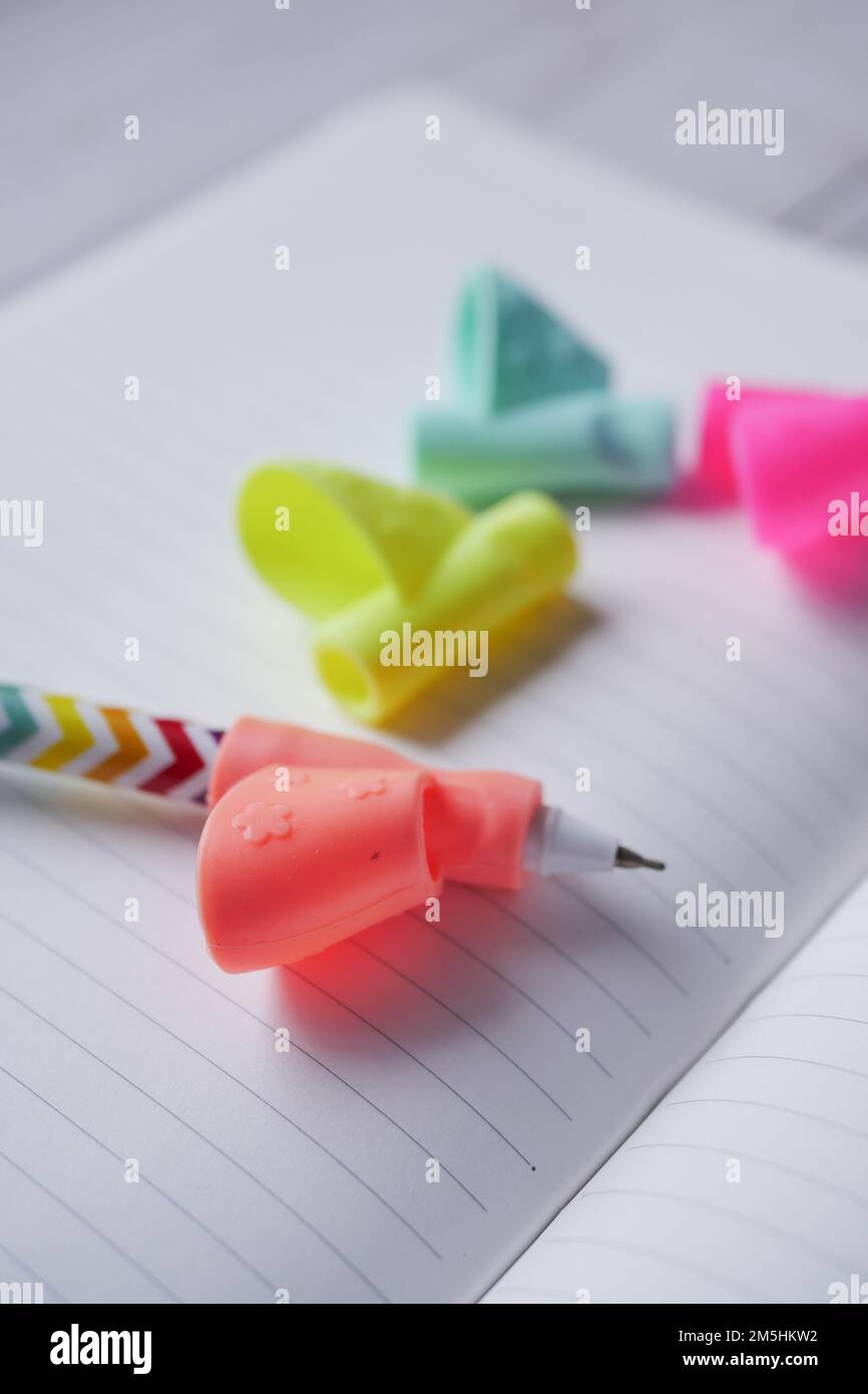 writing corrector pen holder postures grip Stock Photo - Alamy