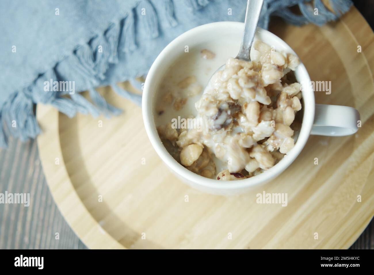 top view of granola Musli and milk in a cup on table Stock Photo - Alamy