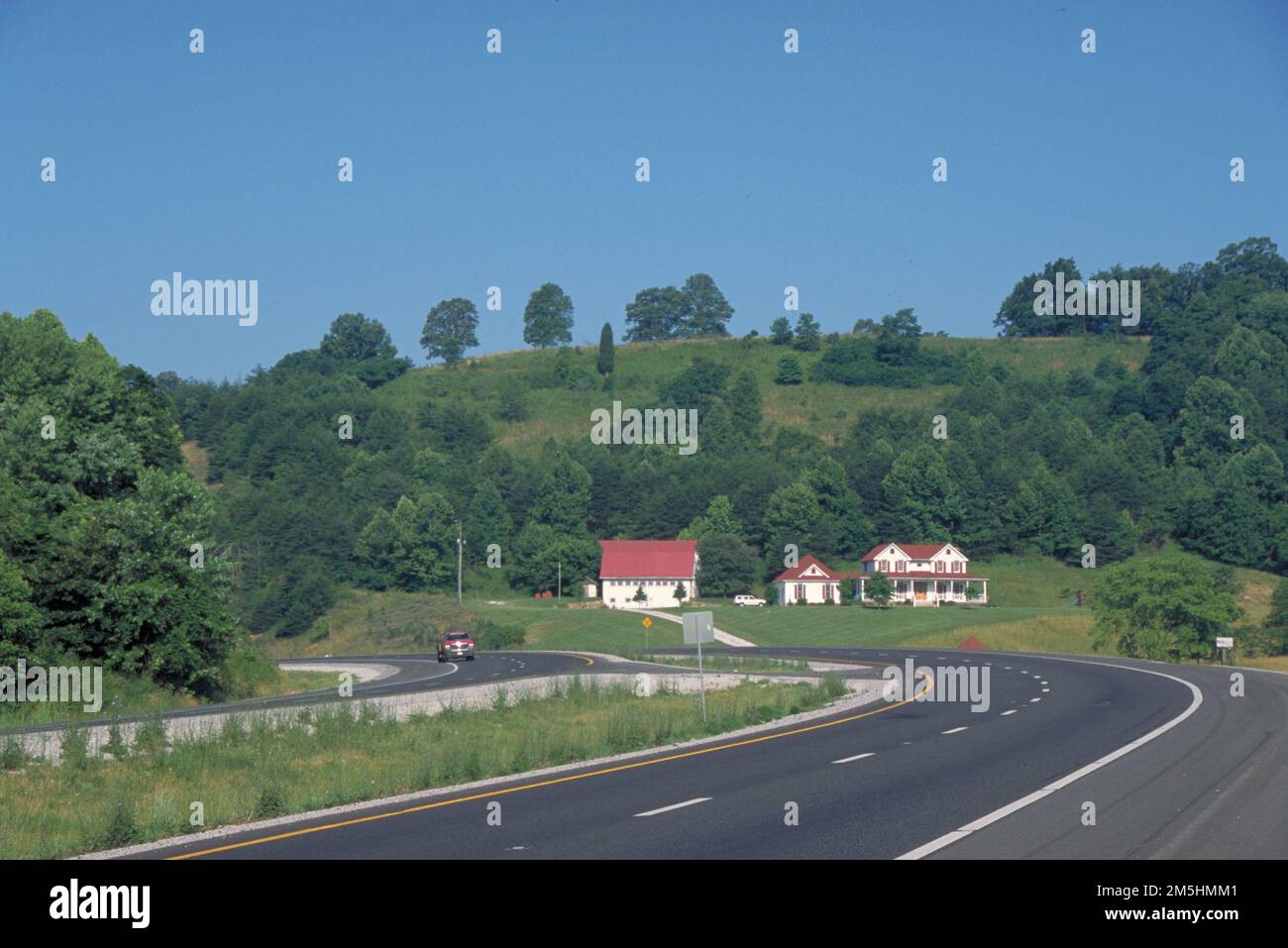 Country Music Highway - Farm Tucked Into Hills. The bright red roofs ...