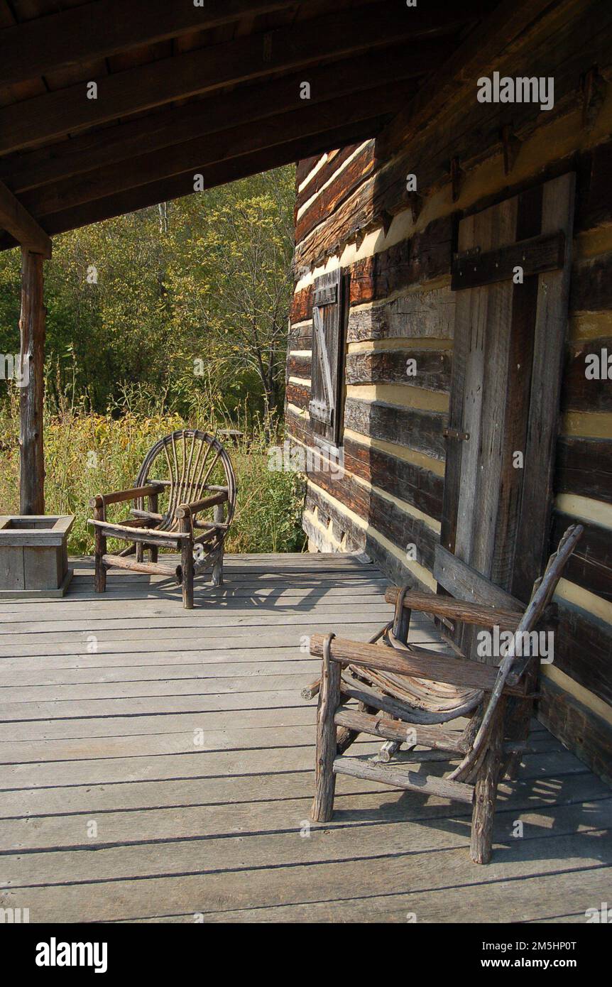 Red River Gorge Scenic Byway - Chairs on the Porch. Two old wooden chairs sit on the shaded ...