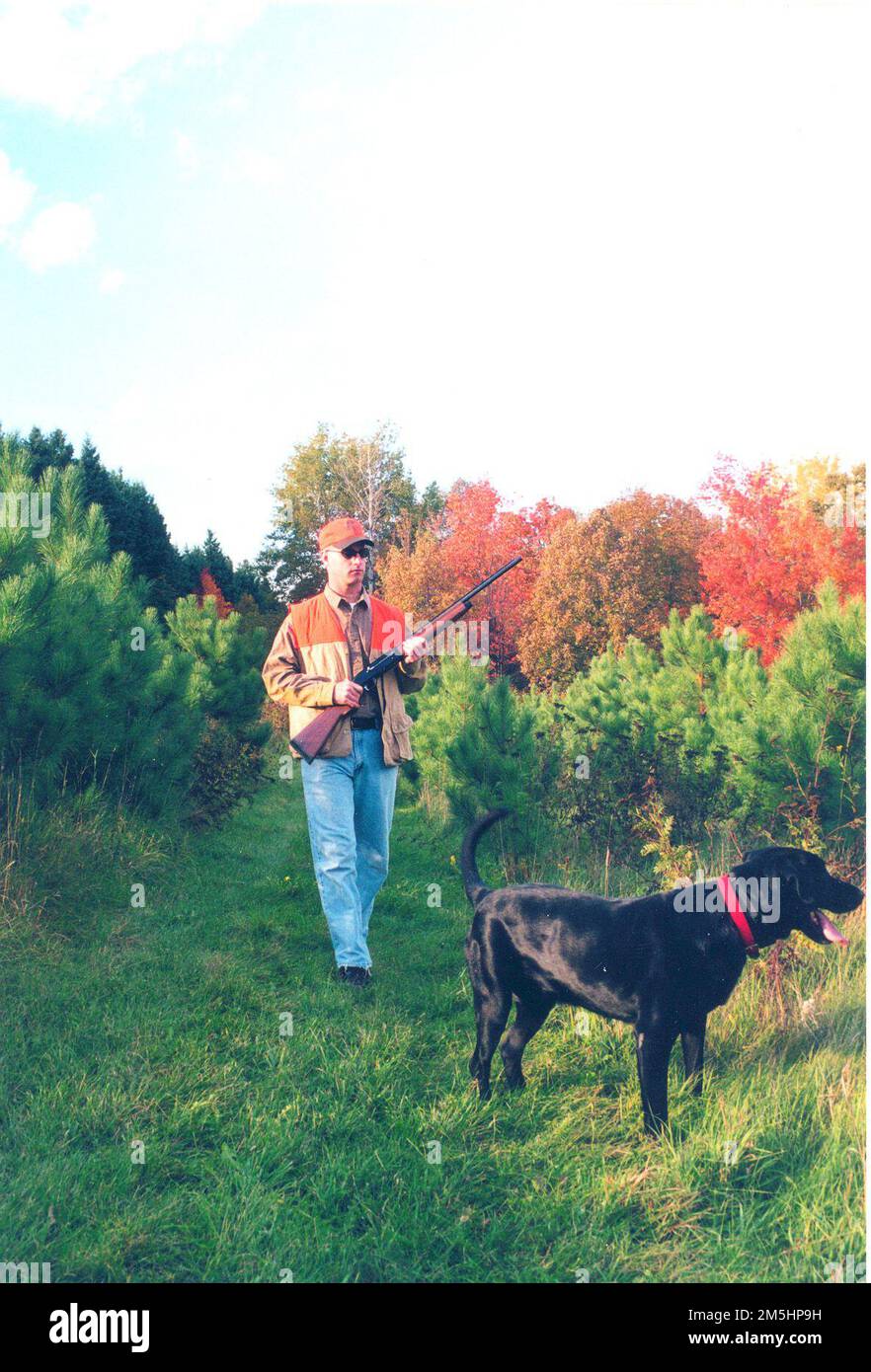 Edge of the Wilderness - A Hunter and His Dog. A hunter and his dog ...