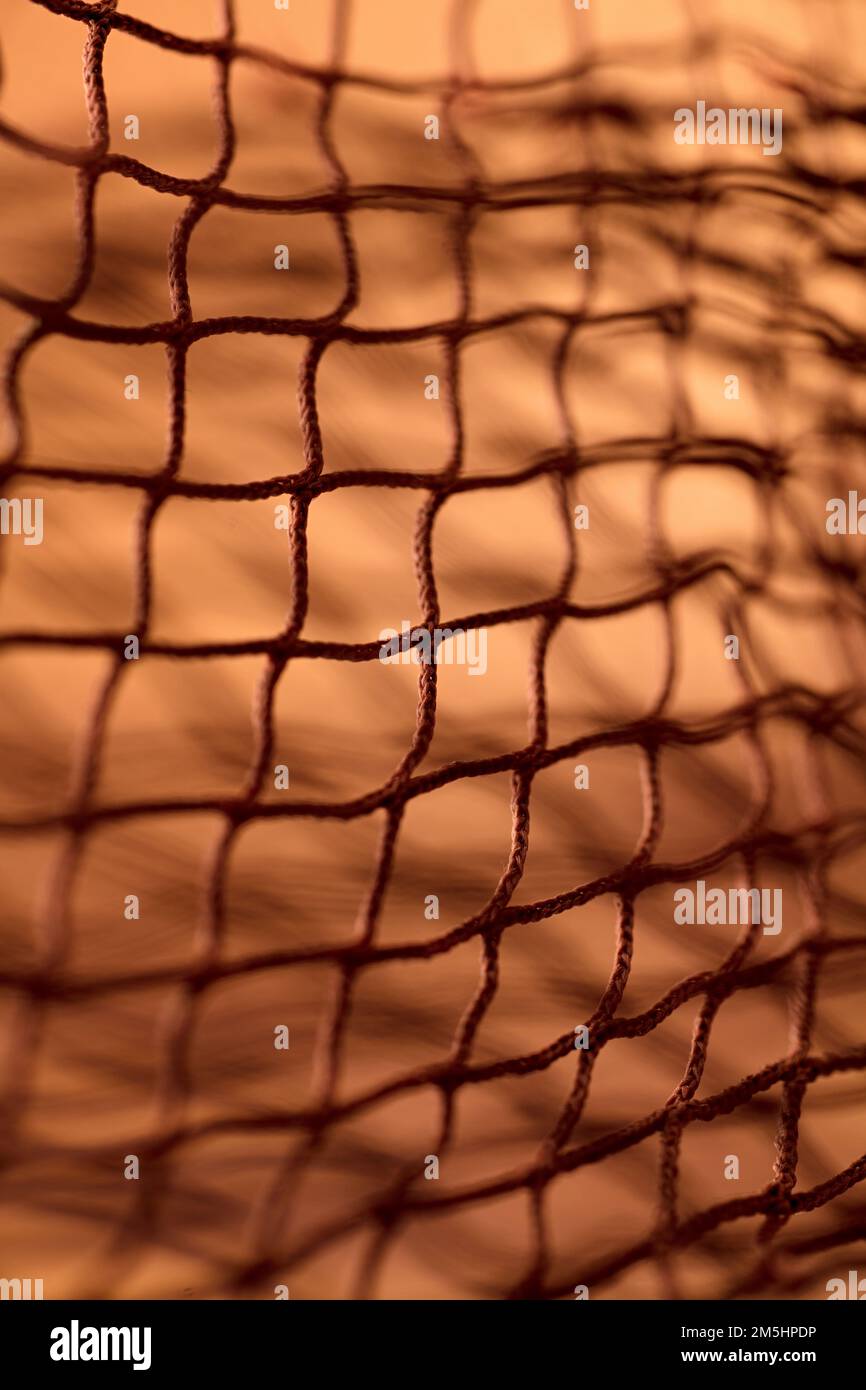 Brown fishing net, on soft brown background Stock Photo - Alamy