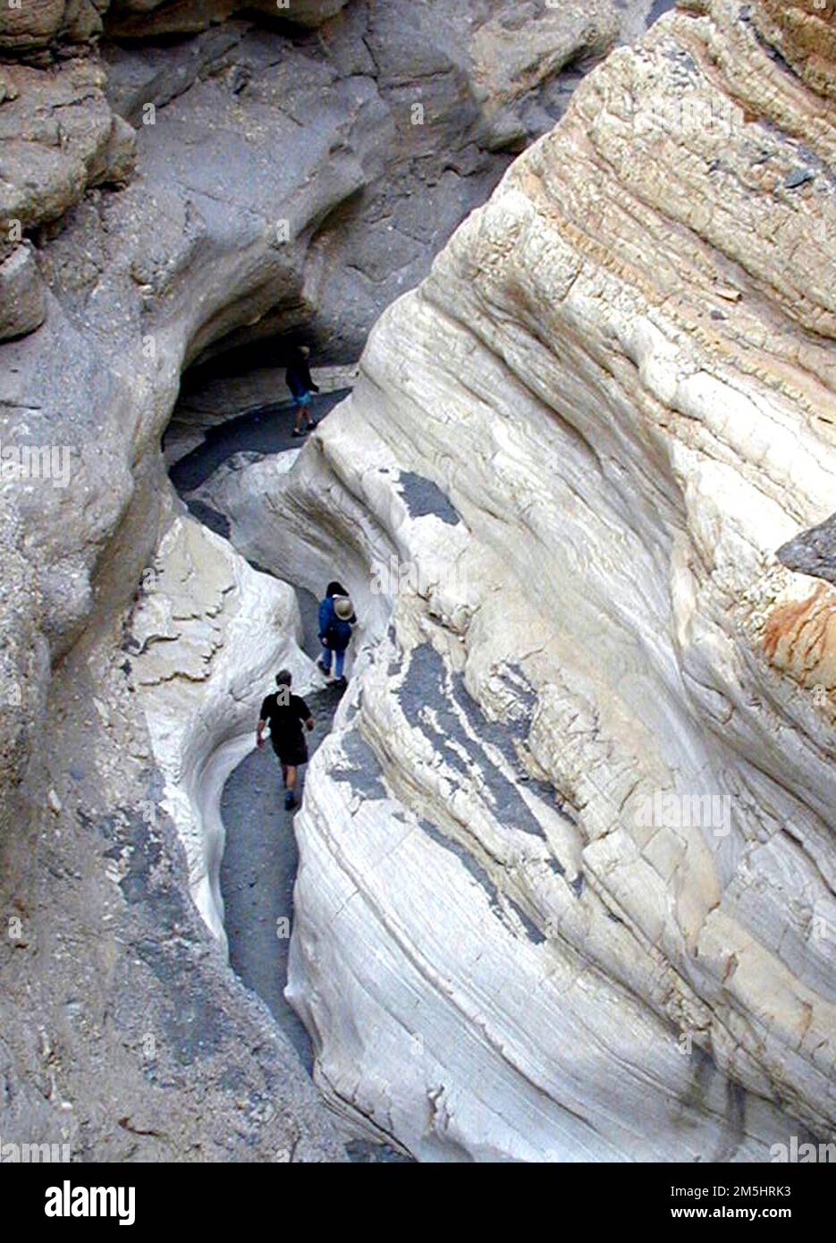 Death Valley Scenic Byway - Mosaic Canyon Narrows. A hiker winds ...