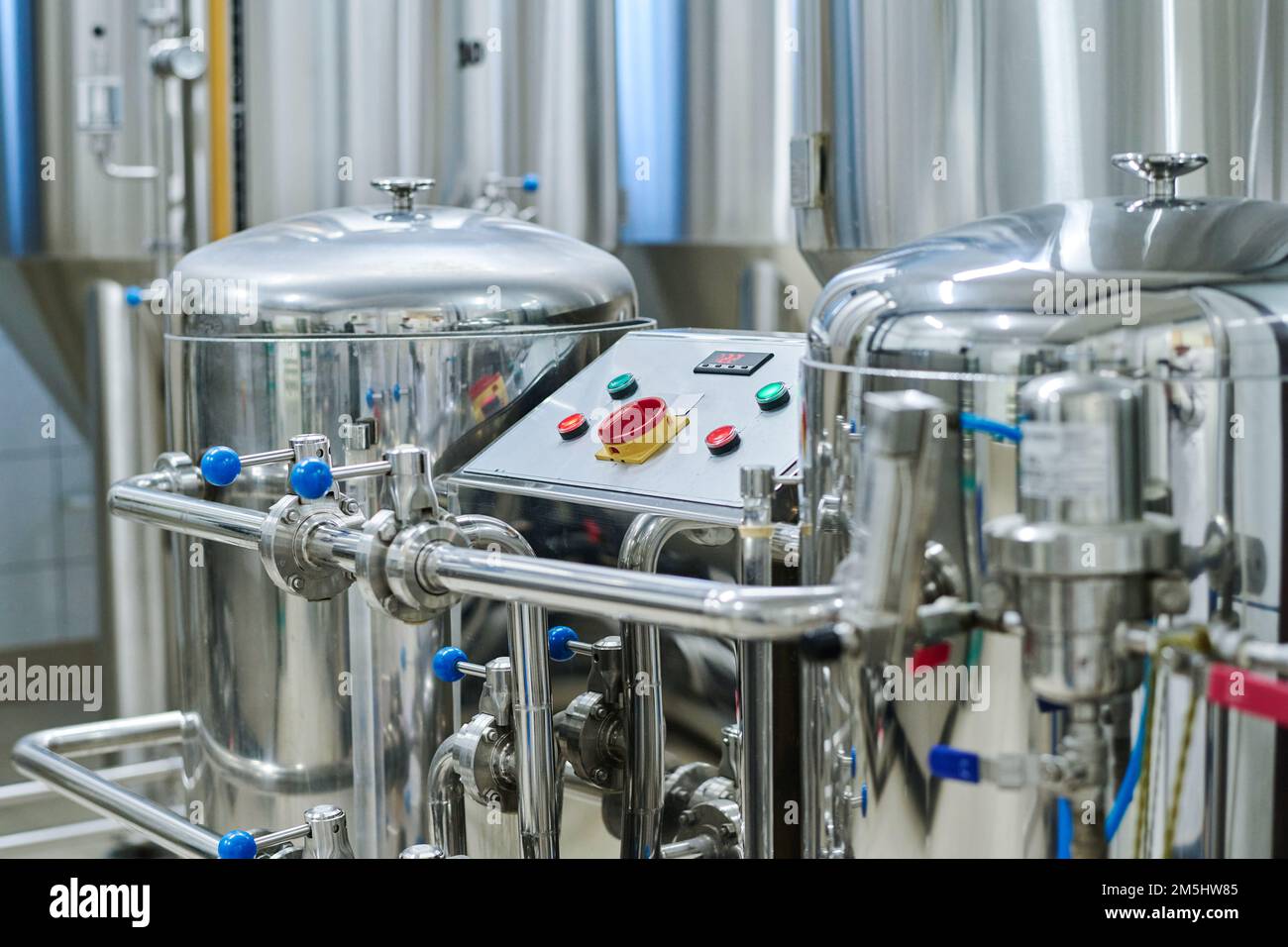 Horizontal image of storage tanks for brewing alcoholic beverages with ...