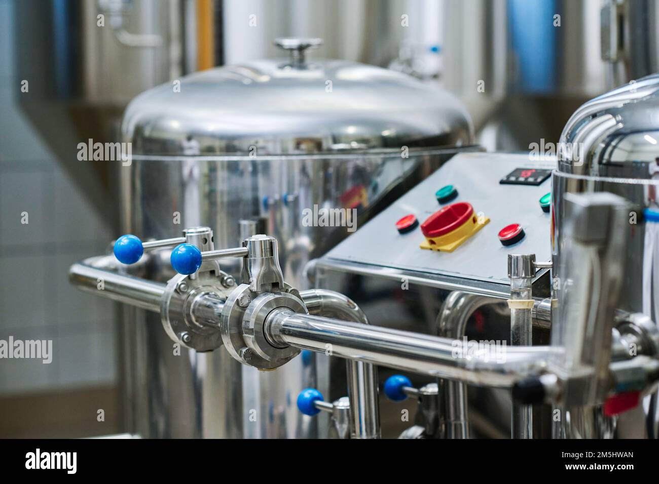 Close-up of stainless steel tanks with control panel for brewing beer ...