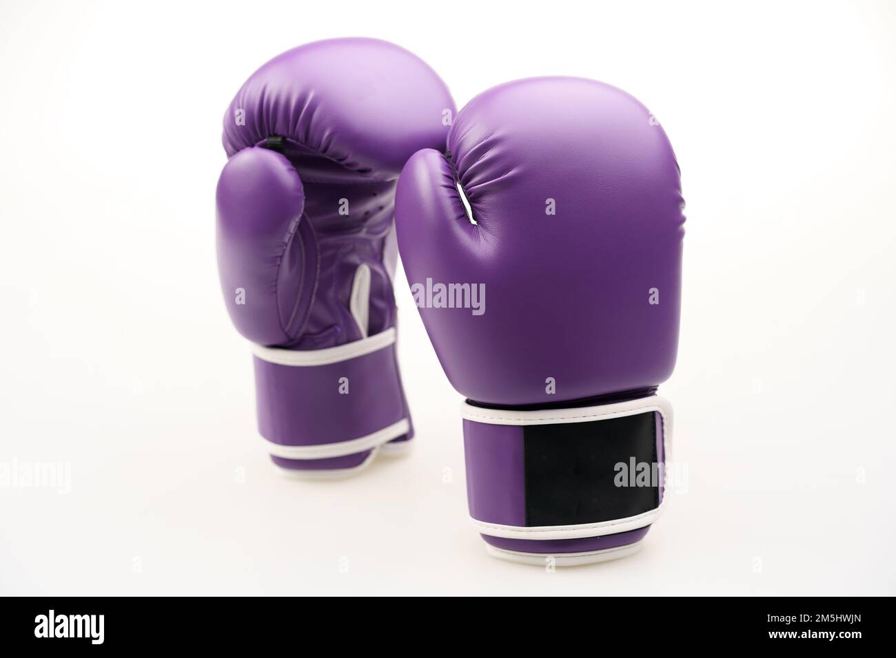 A pair of purple boxing gloves isolated on a white background Stock ...
