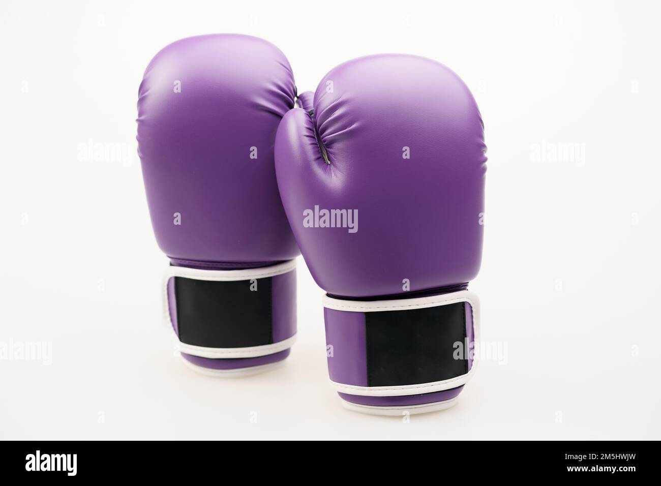 A pair of purple boxing gloves isolated on a white background Stock ...