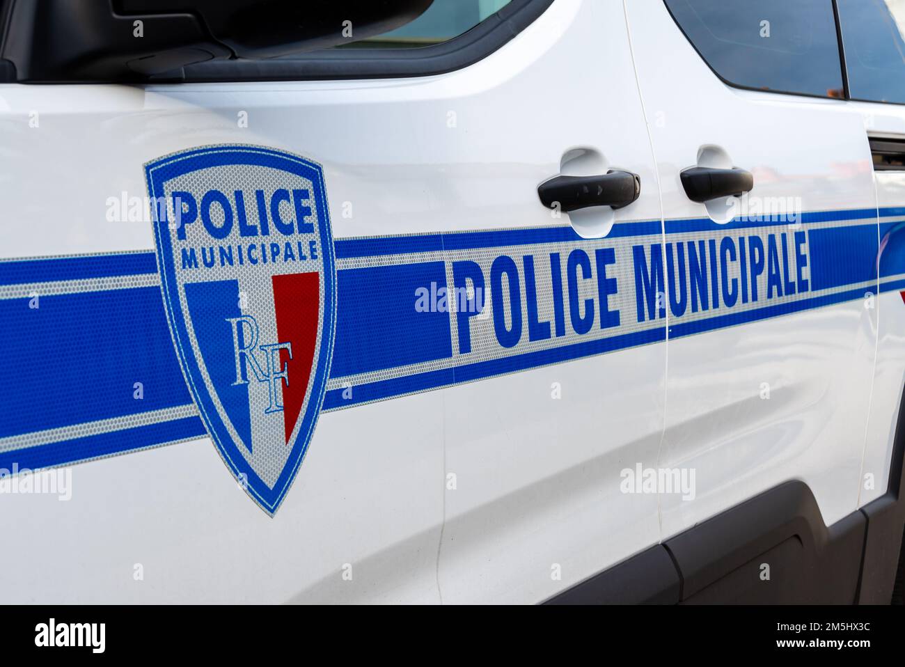 Close up of a "Police municipale" marking written in French on the side ...