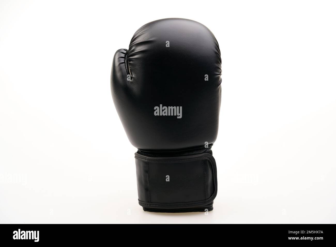 A single black boxing glove isolated on a white background Stock Photo ...
