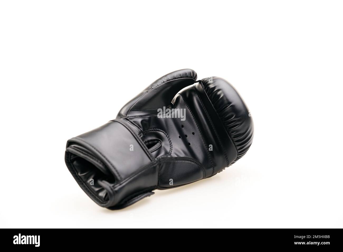 A single black boxing glove isolated on a white background Stock Photo ...
