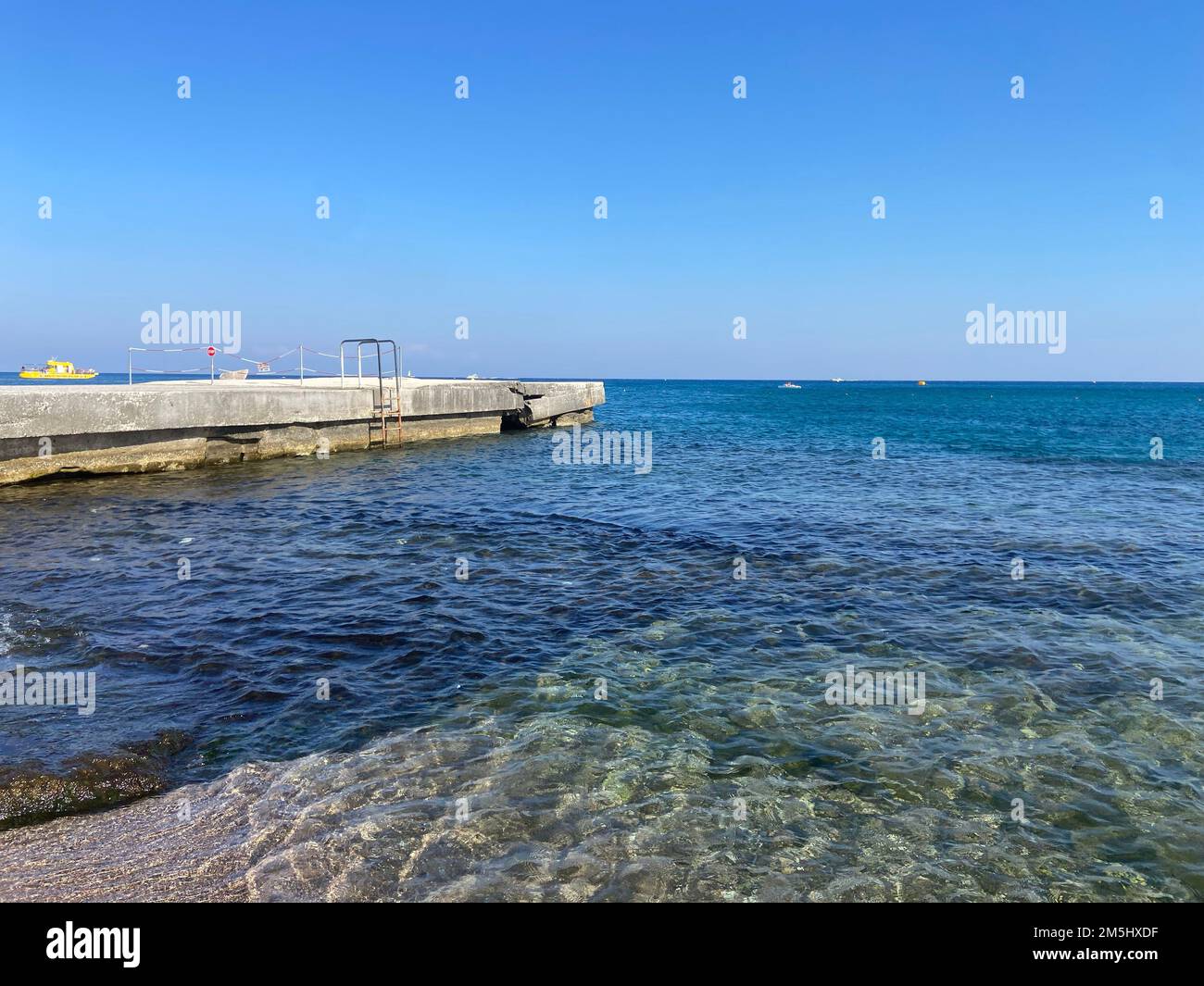 A stone pier over a sea Stock Photo - Alamy