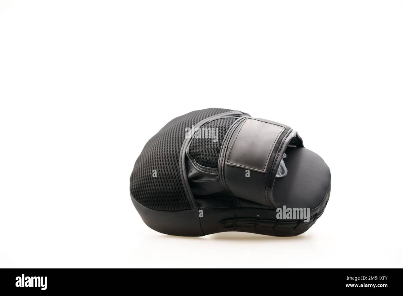 A single black boxing pad isolated on a white background Stock Photo ...