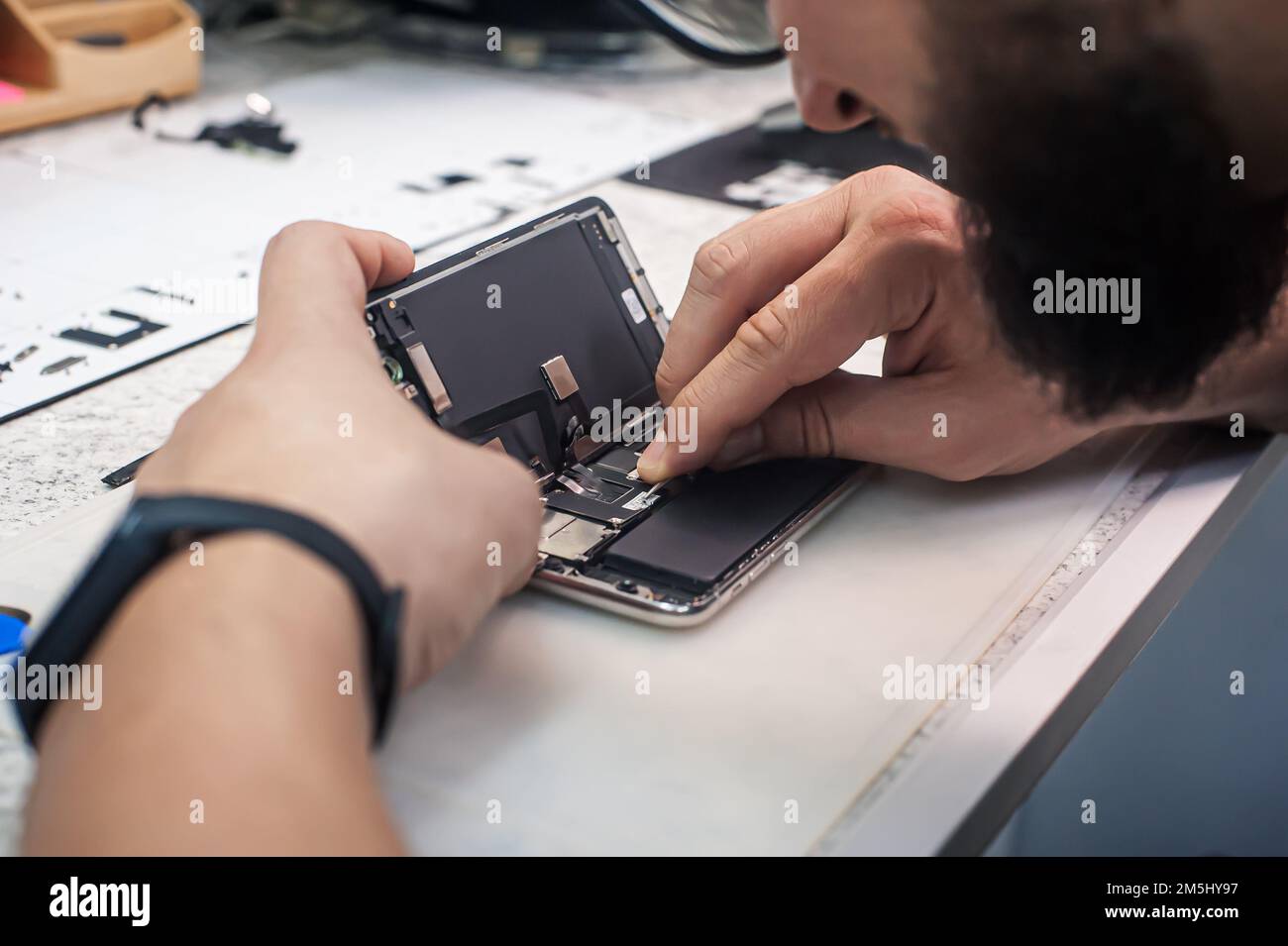 Technician repairs motherboard smartphone hi-res stock photography and ...